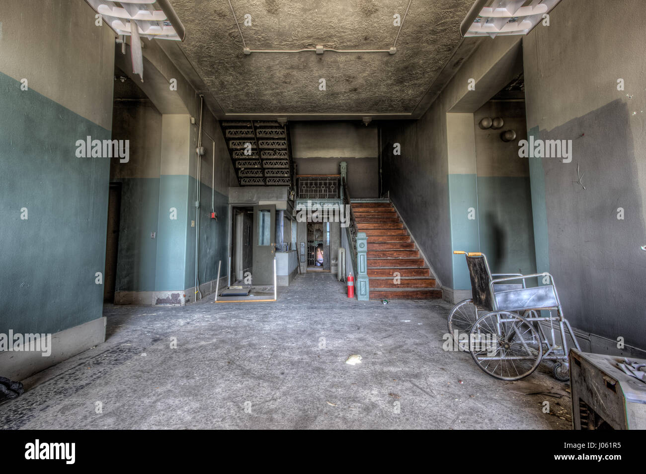 A lost wheelchair stands still in the forgotten corridor. THE HAUNTING ...