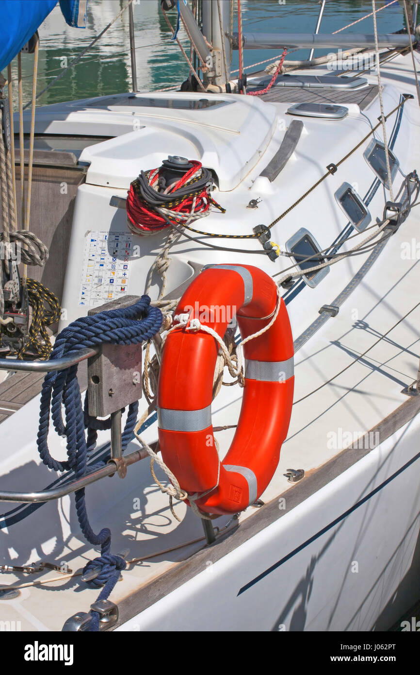 Sailing boat equipped with lifeline and ropes Stock Photo - Alamy
