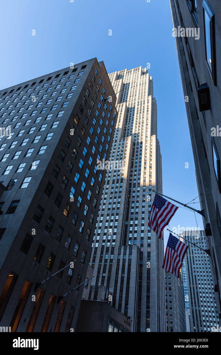 Flags hanging from apartment buildings on Fifth Avenue, New York Stock ...