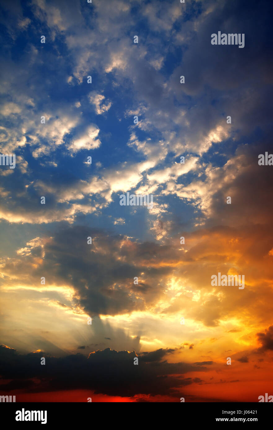 Multicolor sunset sky with clouds and sun rays above the sea Stock ...