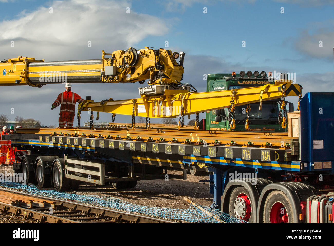 Rail workers laying new line in Forres Scotland Stock Photo - Alamy