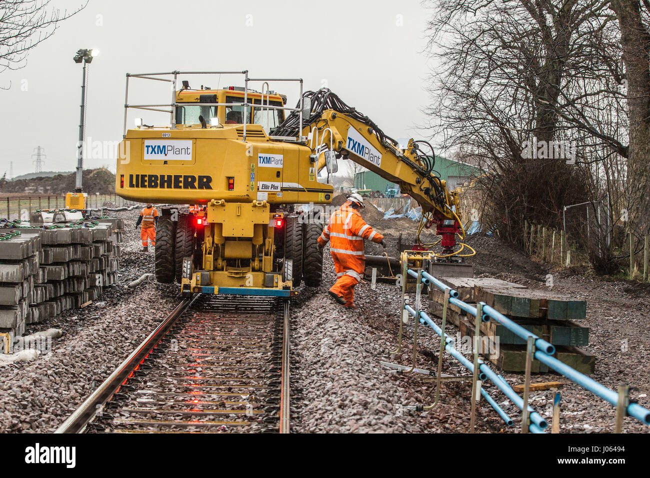 Rail workers laying new line in Forres Scotland Stock Photo - Alamy