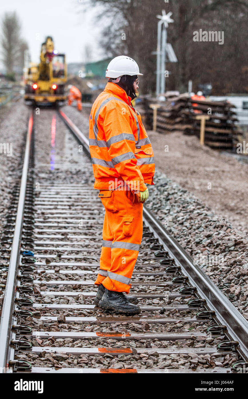 Rail workers laying new line in Forres Scotland Stock Photo - Alamy