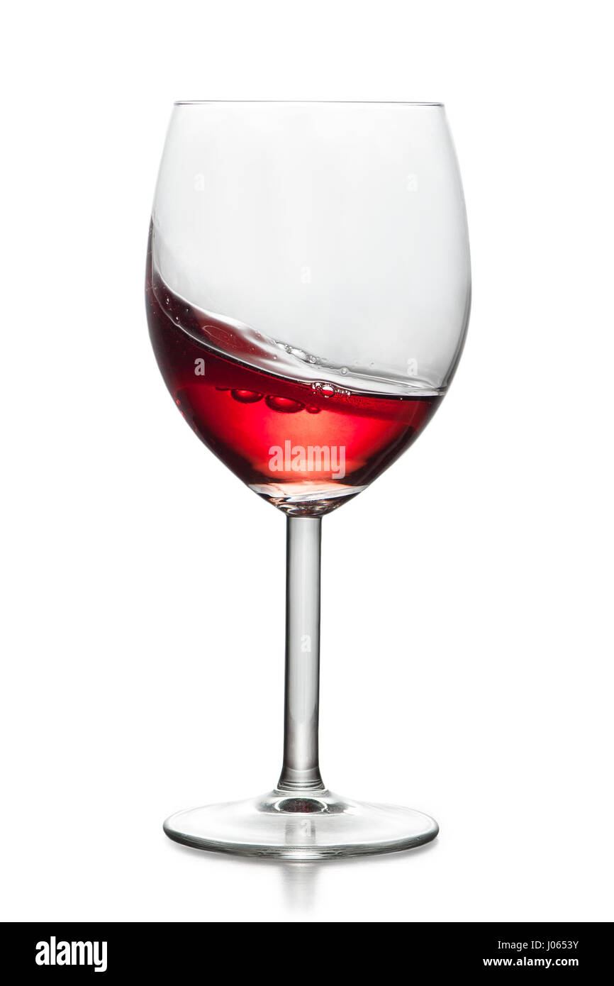 Moving red wine glass over a white background Stock Photo - Alamy