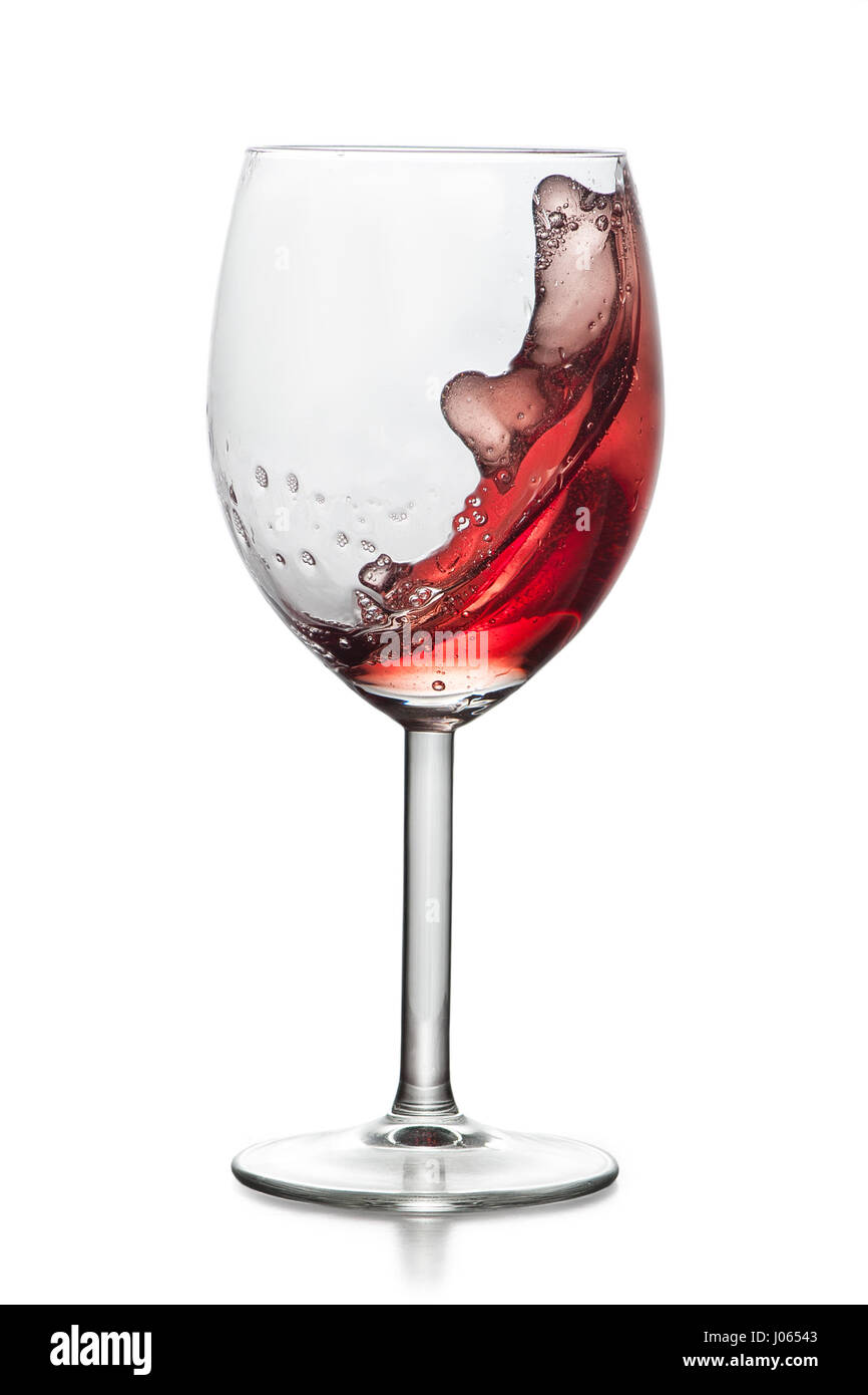 Moving red wine glass over a white background Stock Photo - Alamy