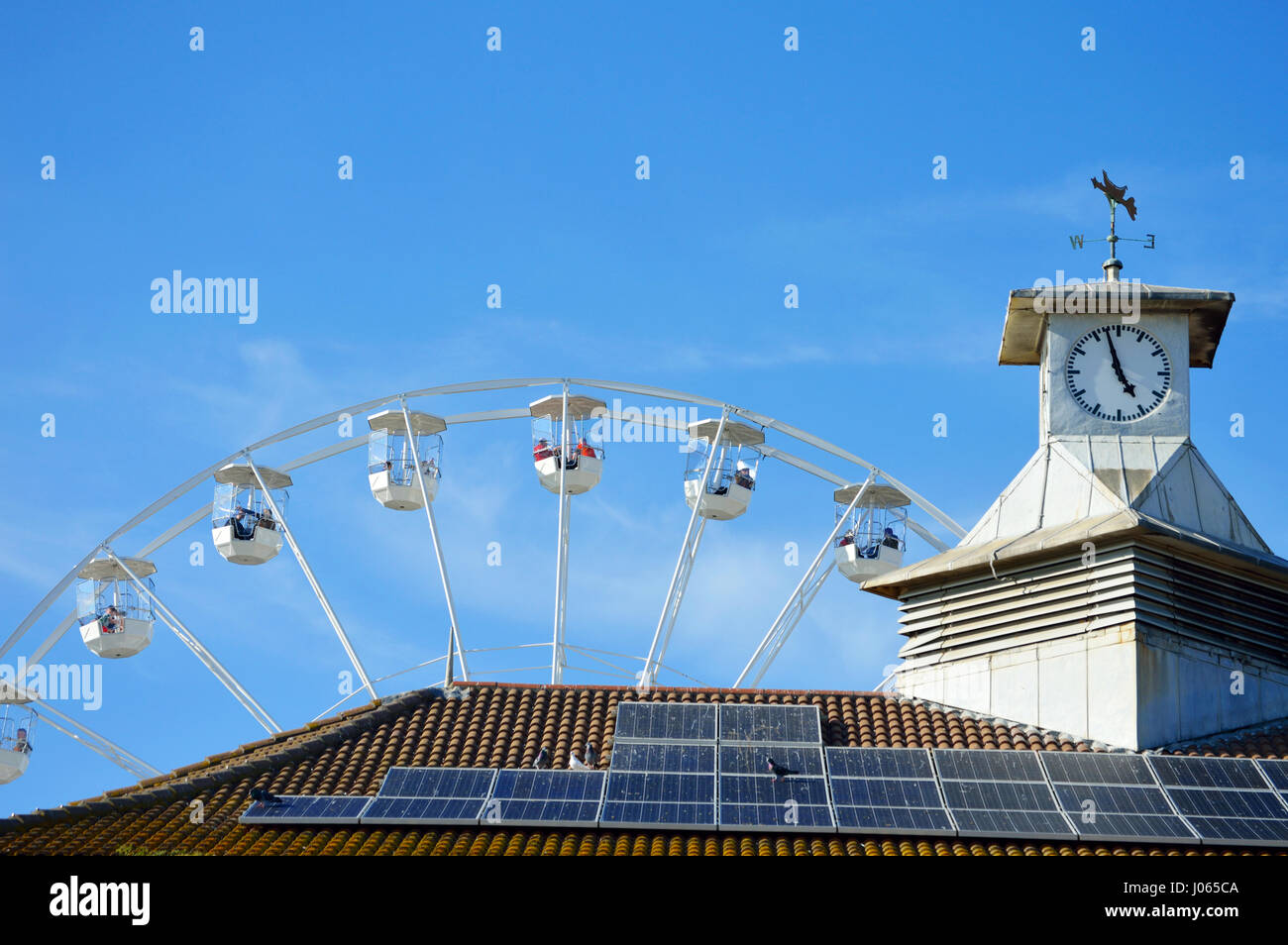 View over Bournemouth Pier's roof with clock tower and the Big wheel in ...