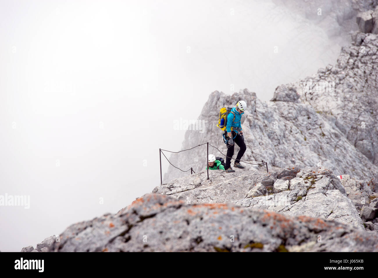 Two mountain climbers on the way to the top of the Watzmann Mountain in ...