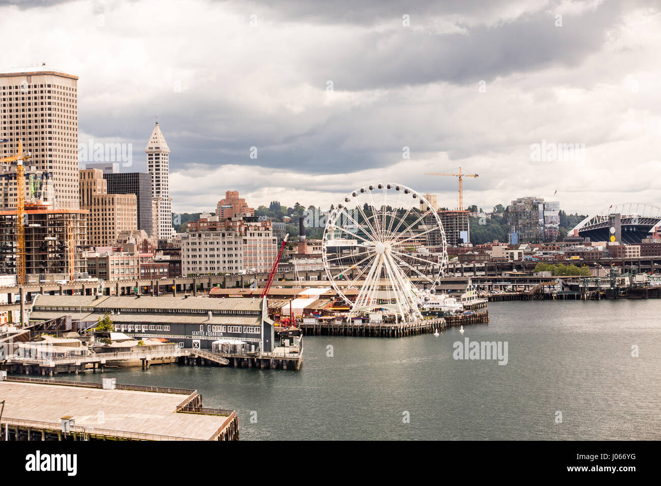 Seattle waterfront with boats, freight, and ferris wheel Stock Photo ...