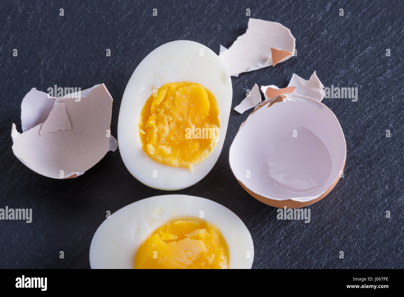 Sliced hard boiled eggs on slate tile Stock Photo - Alamy