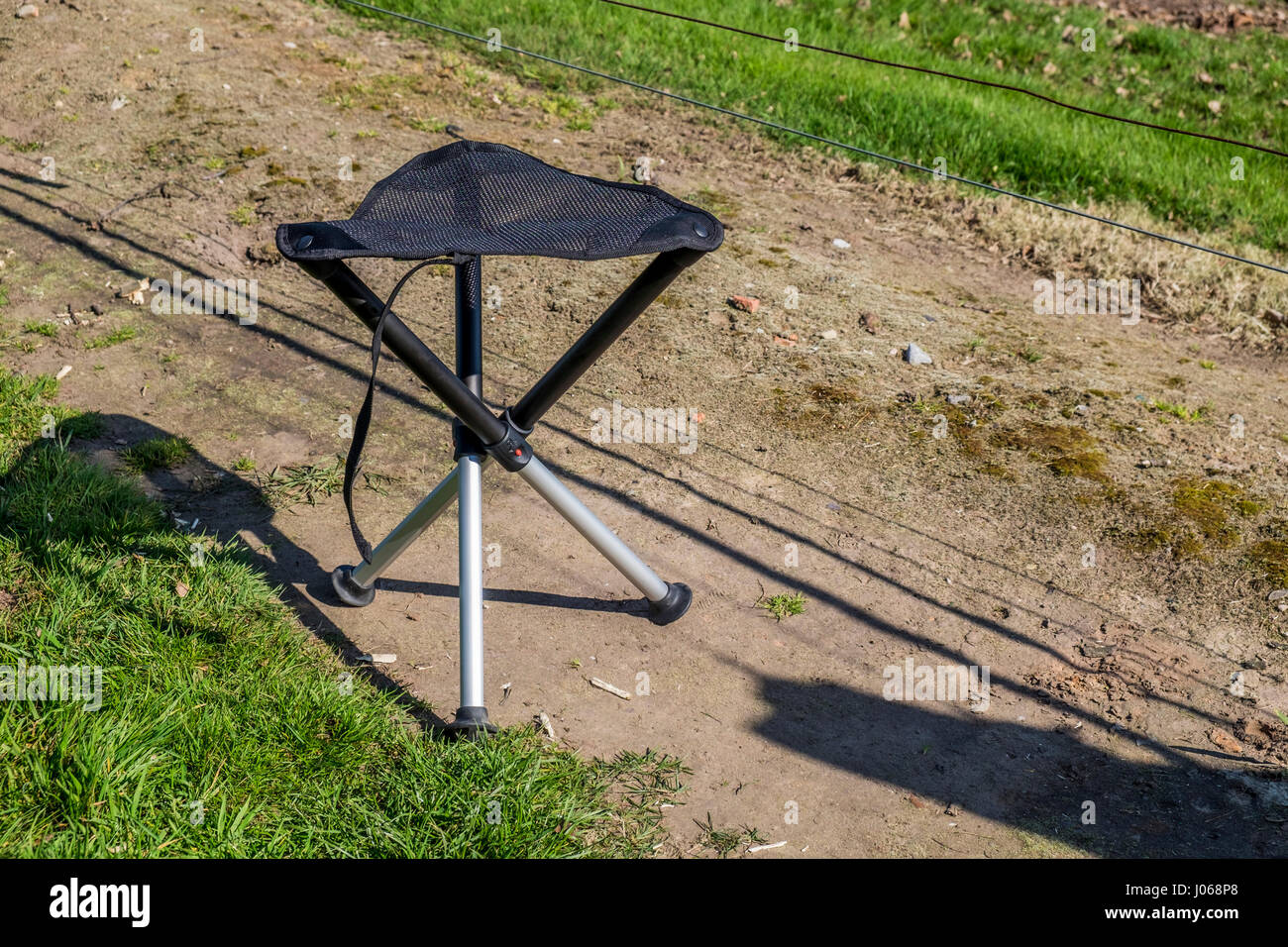 An empty collapsable stool by the side of the race track at Oulton Park ...