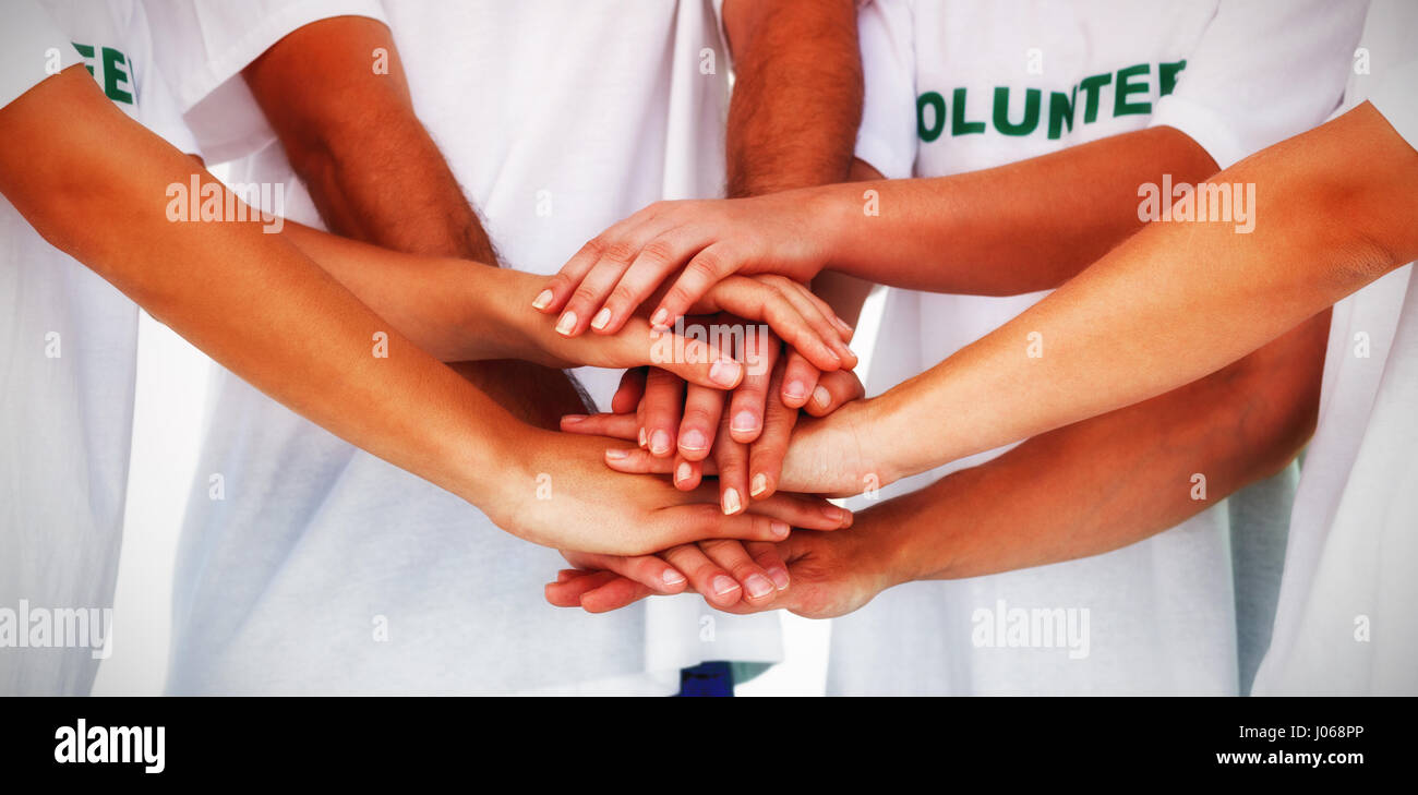 Group of volunteers putting hands together on white background Stock ...