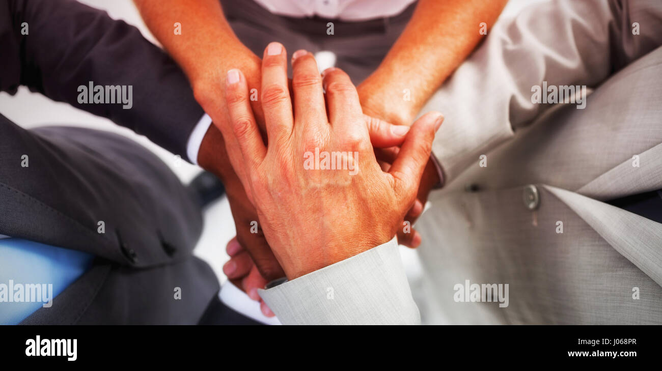 High angle view of business people gathering their hands together Stock ...