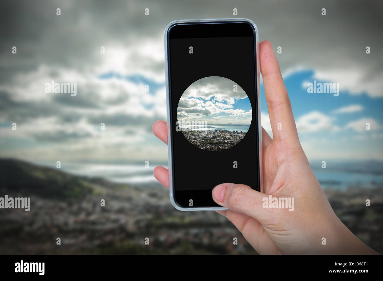 Human hand holding mobile phone against white background against ...