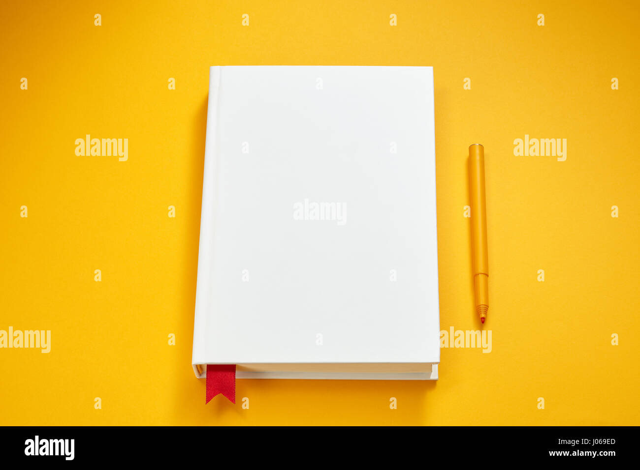 book on the yellow background Stock Photo - Alamy
