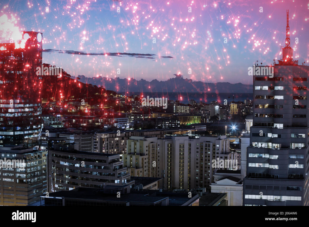 White fireworks exploding on black background against illuminated ...