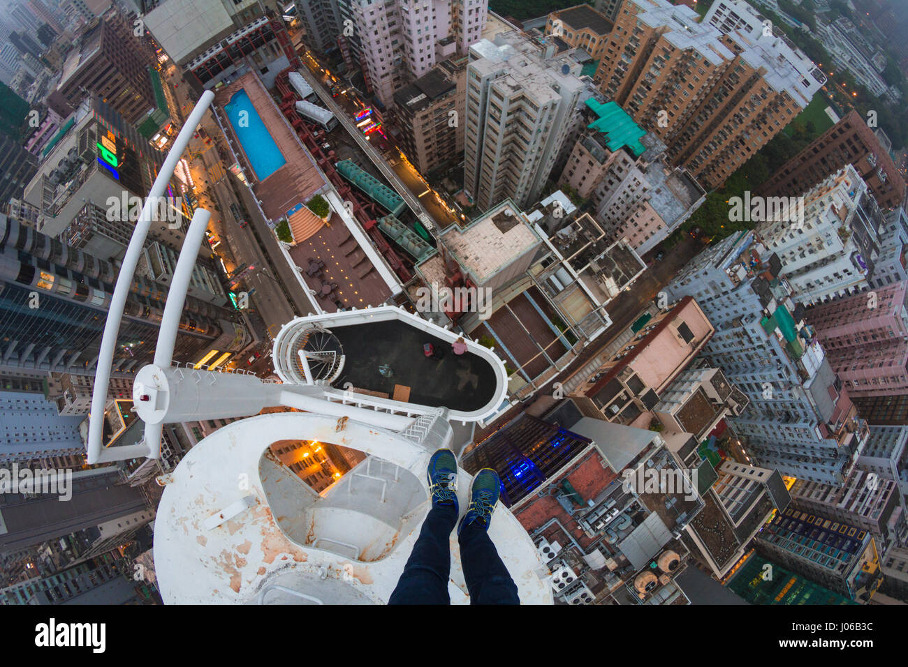 Rooftopper Denis Krasnov looks down over the traffic. MIND-BLOWING pictures of a team of thrill ...