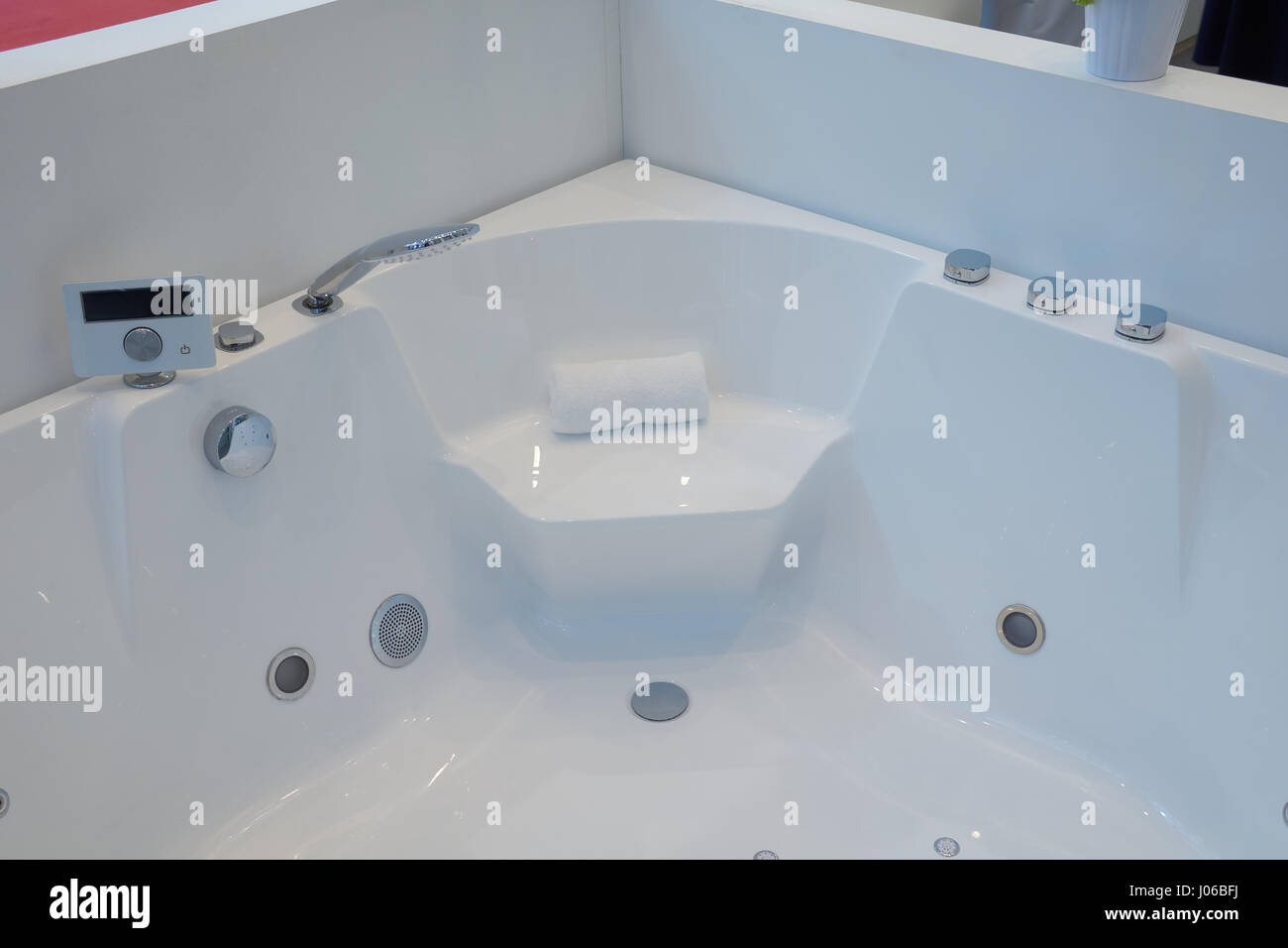 Modern white acrylic spa bath with digital control Stock Photo - Alamy