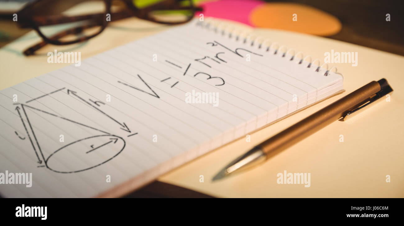 Diagram and equation against black background against high angle view ...