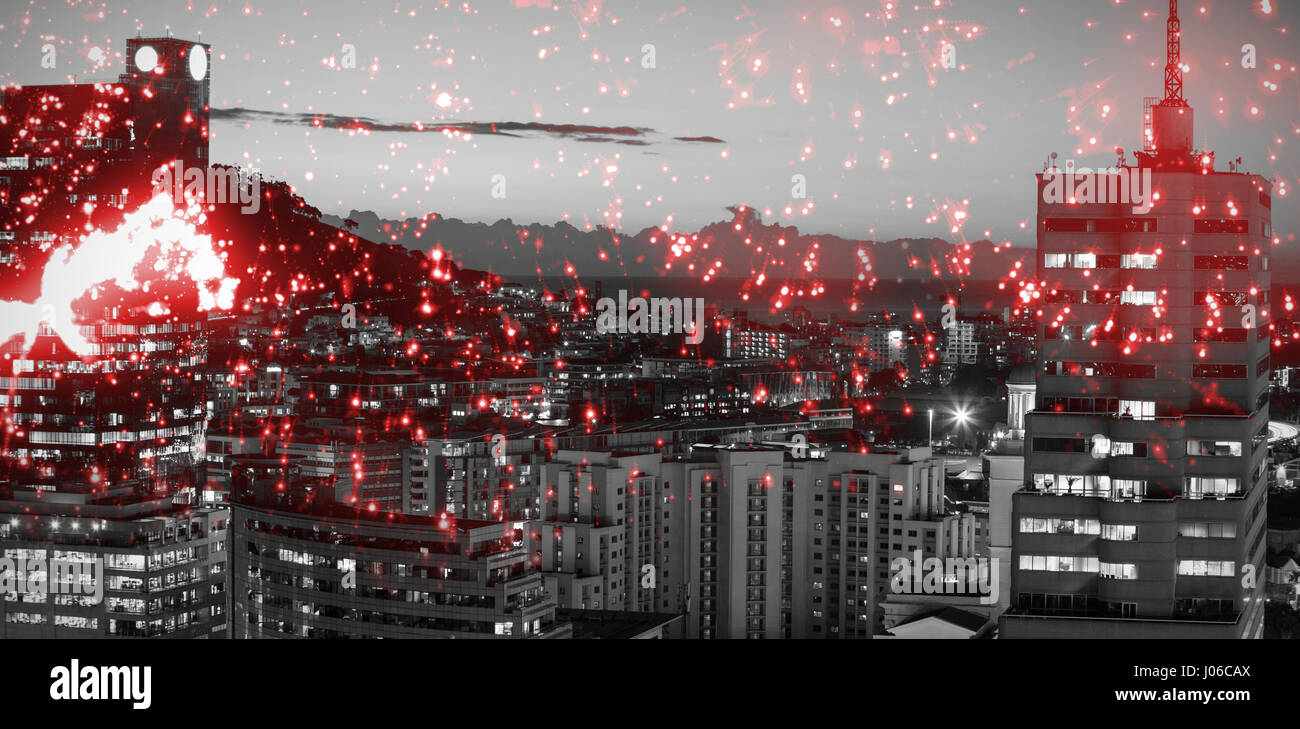 White fireworks exploding on black background against illuminated ...