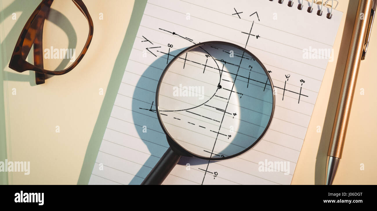 Maths pattern against black background against magnifying glass on ...