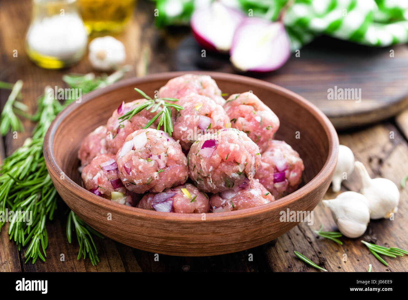 Raw meatballs close-up on wooden background Stock Photo - Alamy