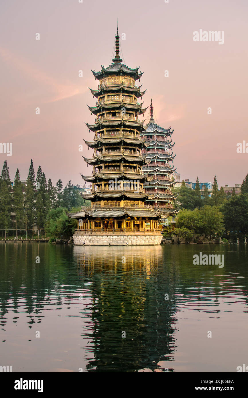 Two towers in Guilin city, China at sunset time Stock Photo - Alamy