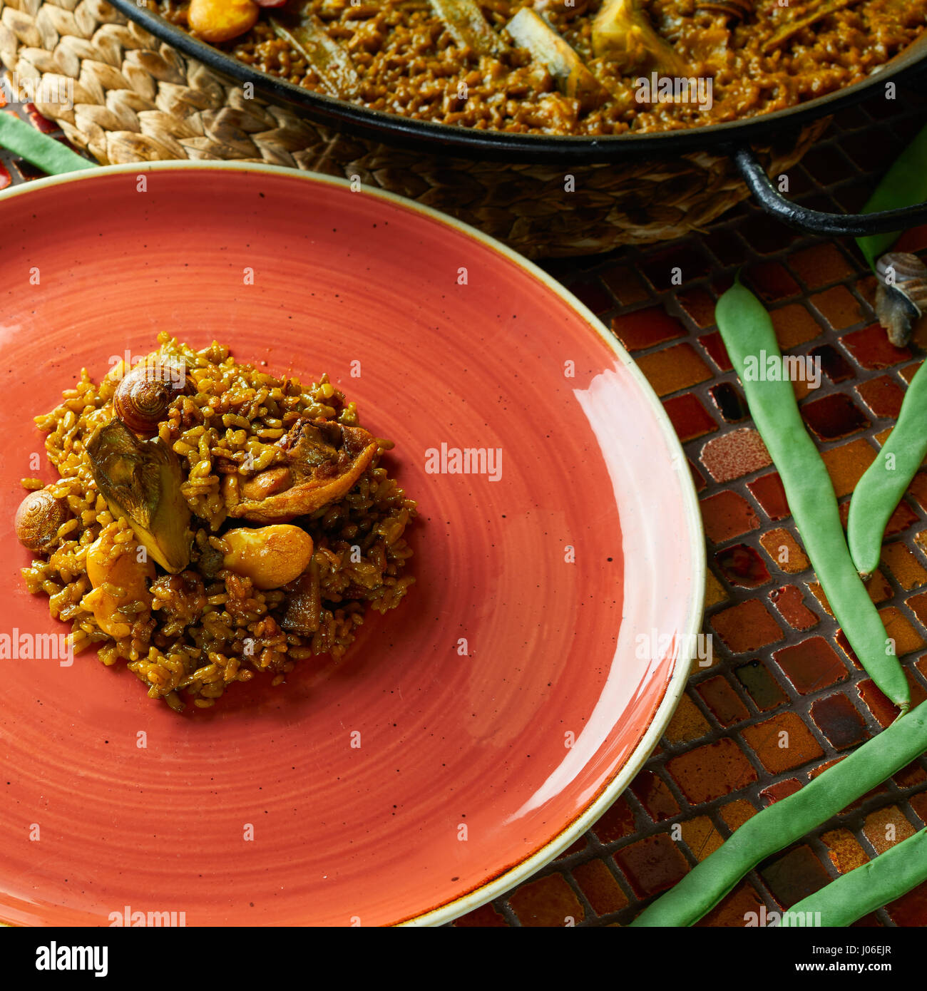 Valencian Paella with chicken rabbit artichokes beans and snails Stock ...