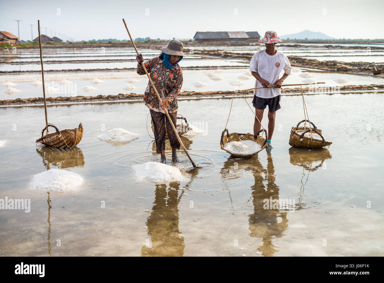 Local people working in the salt fields of Kampot, Cambodia, Asia Stock ...