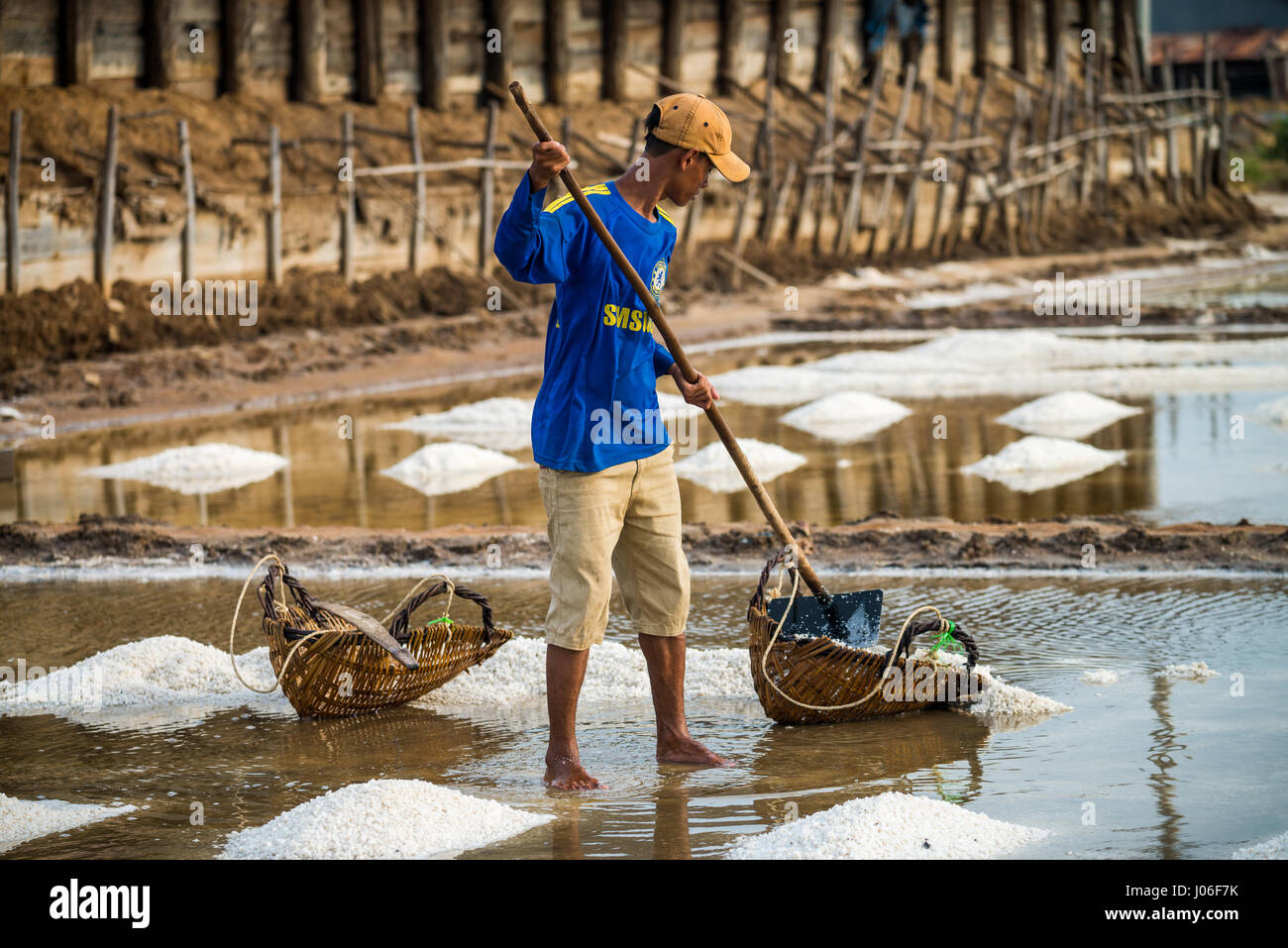 Local people working in the salt fields of Kampot, Cambodia, Asia Stock ...