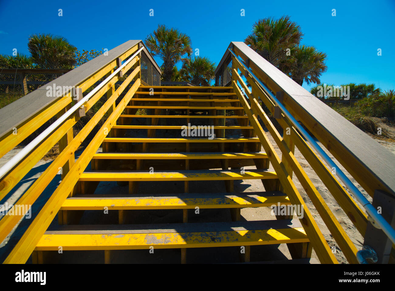 steps to beach with yellow steps Stock Photo - Alamy