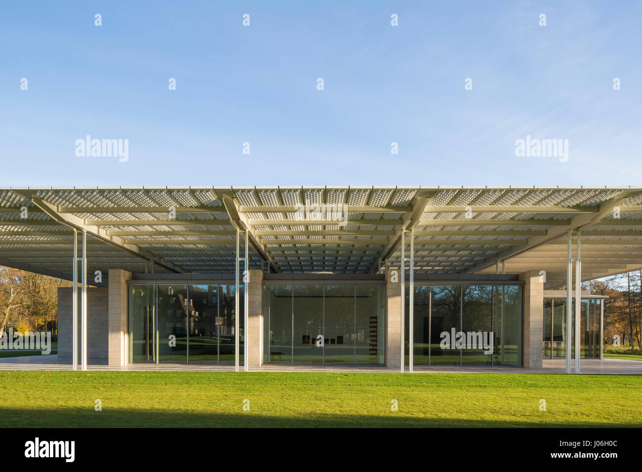 Front elevation with roof overhang and steel colonnade. Museum ...