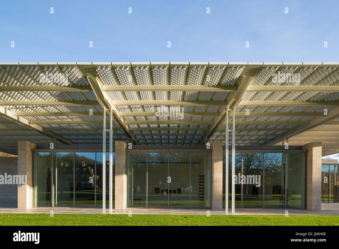 Front elevation with roof overhang and steel colonnade. Museum ...
