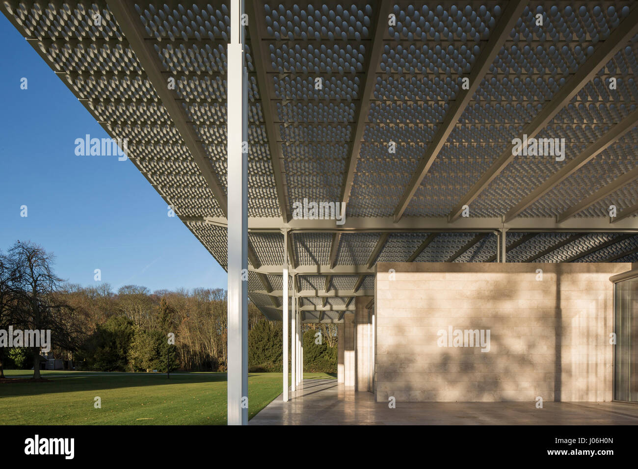 Detailed elevation with roof overhang, steel colonnade and stone facade ...
