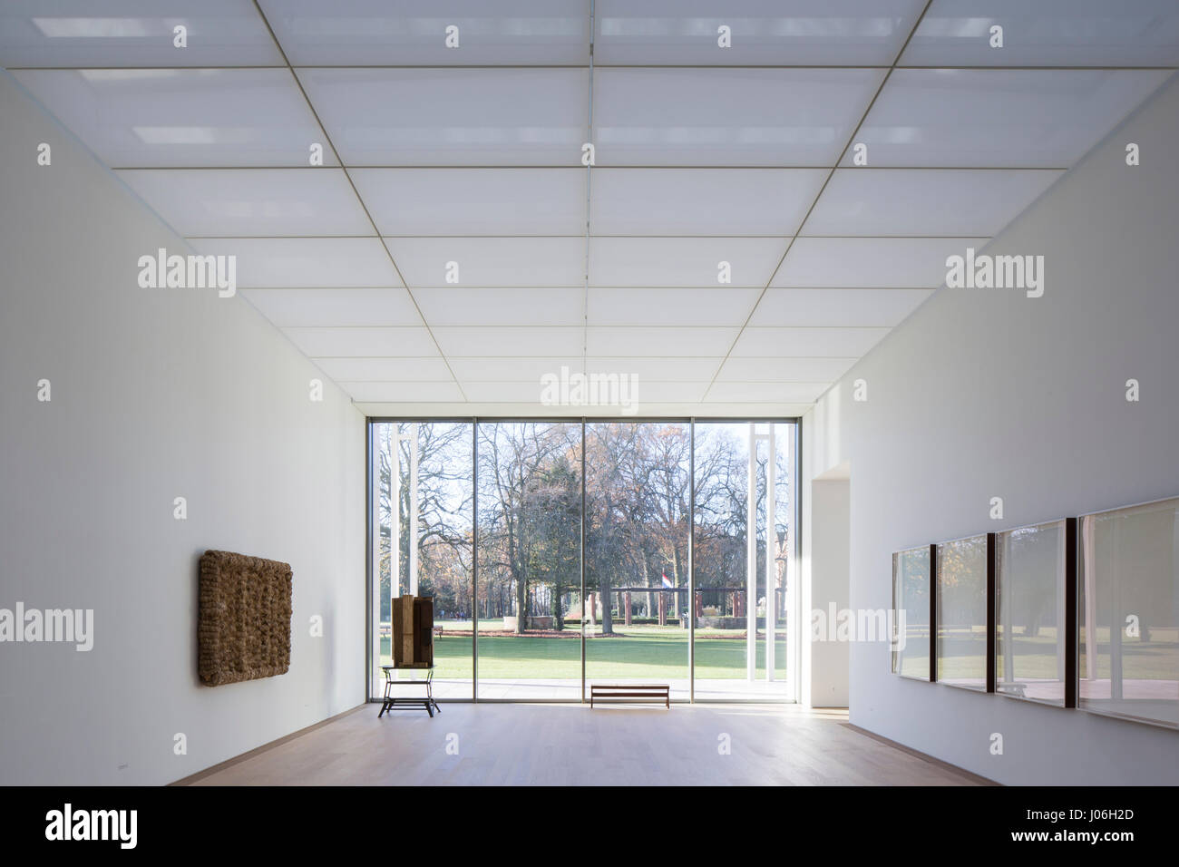 Exhibition space with window wall and view towards park grounds. Museum ...