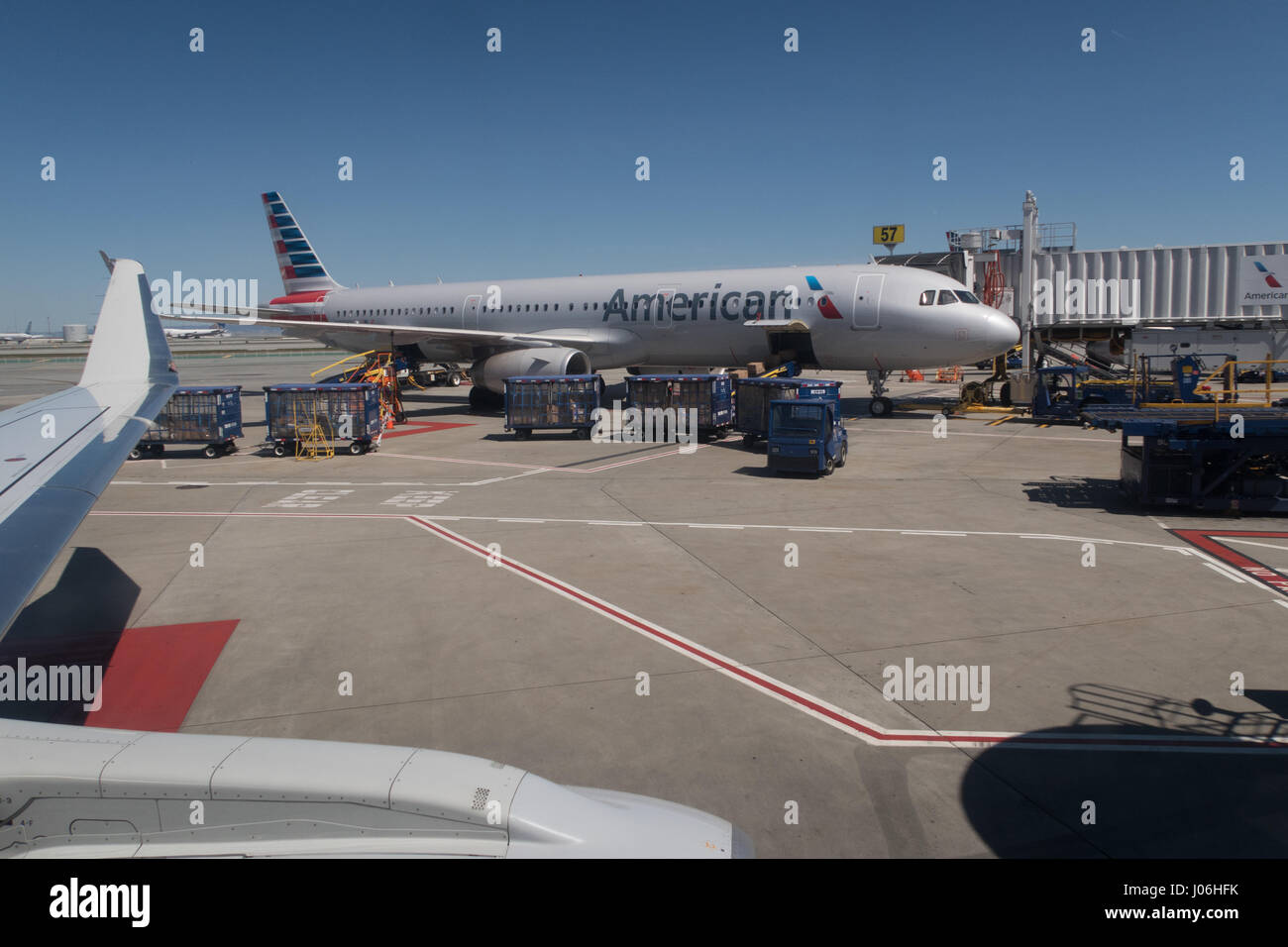 American Airlines plane at a jet bridge at SFO airport Stock Photo - Alamy
