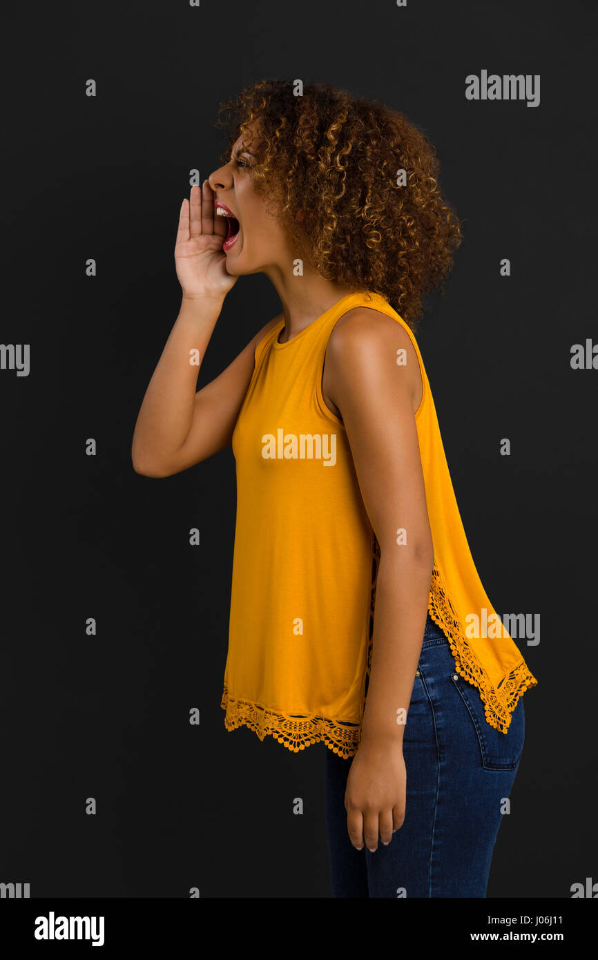 Beautiful African American woman calling someone Stock Photo - Alamy