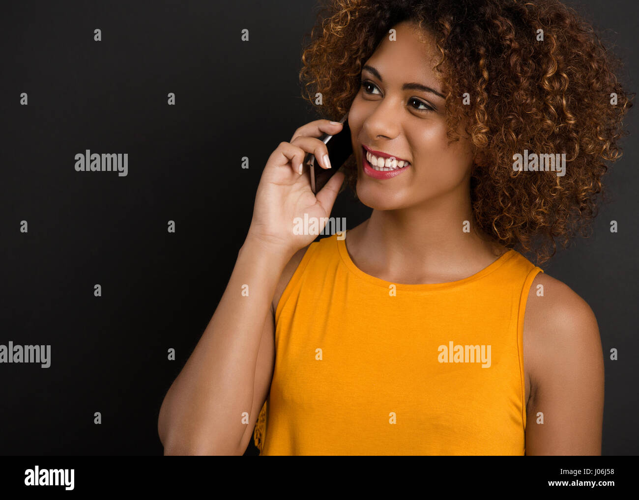 Beautiful African American woman making a phone call and laughing Stock ...