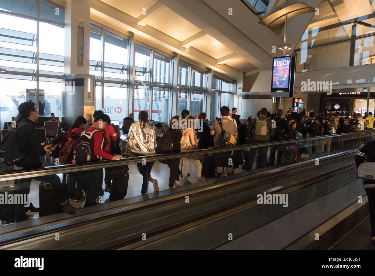 Passengers waiting at an airport boarding gate Stock Photo - Alamy