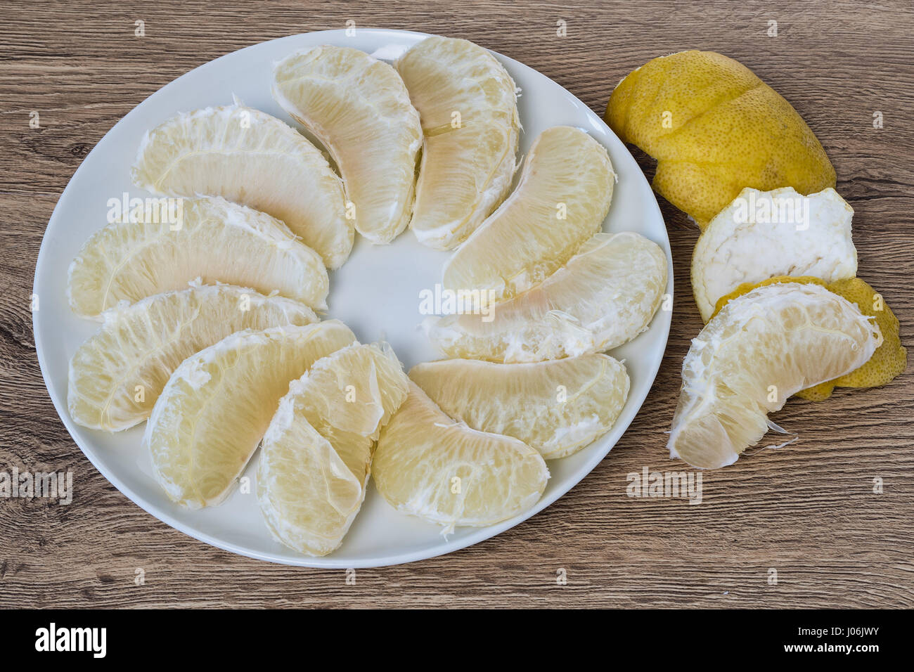 pomelo slice in dish from above Stock Photo - Alamy