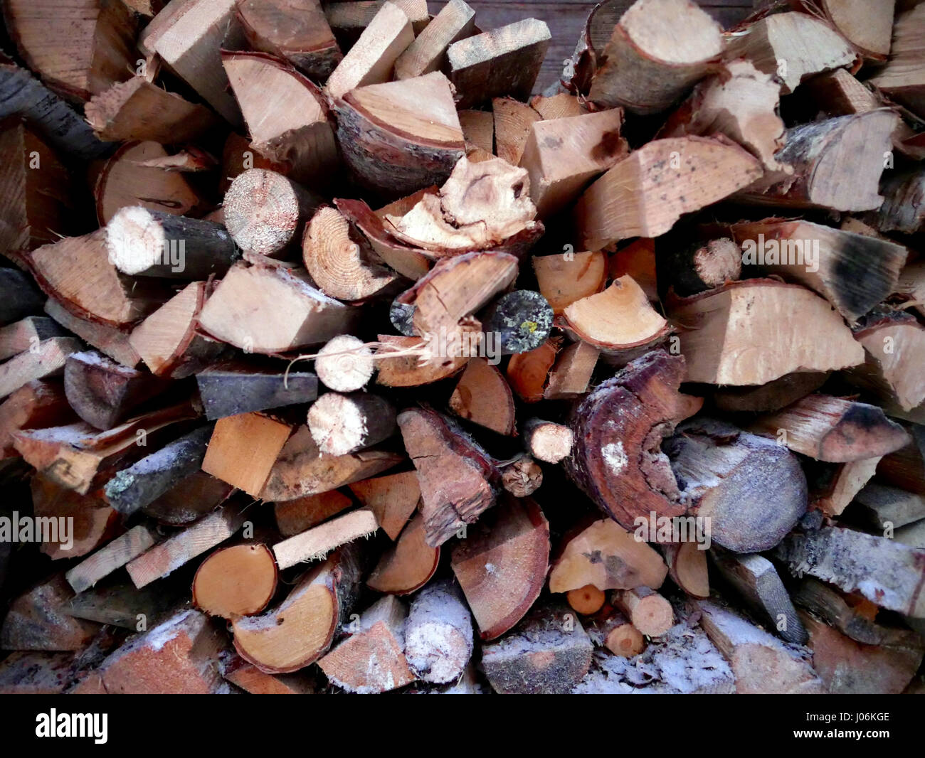 Stacked timber logs ready for use in winter Stock Photo - Alamy