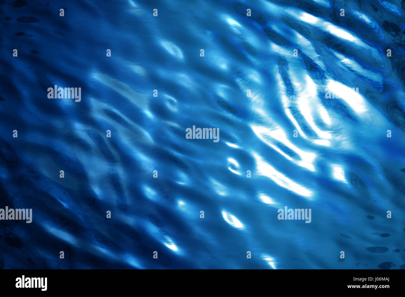 Photo of a blue bright water texture in a river with sun glares Stock ...