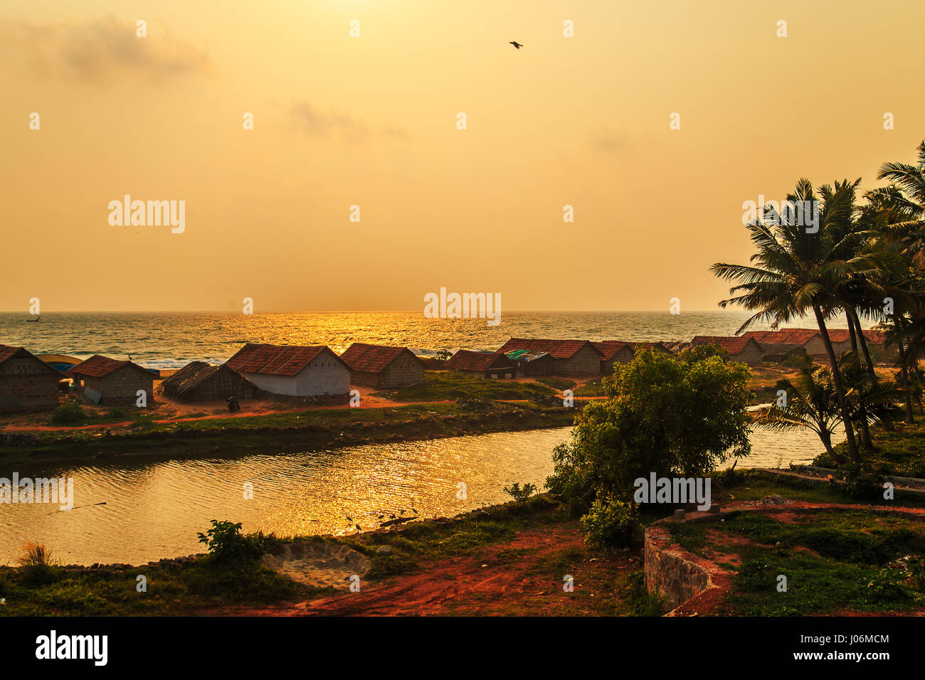 Tropical landscape with blue sky and palm trees. Beautiful beach Kappil ...