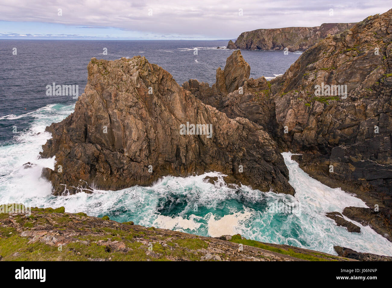 ARAN ISLAND, DONEGAL, IRELAND - Waves crash into the rugged rocky ...