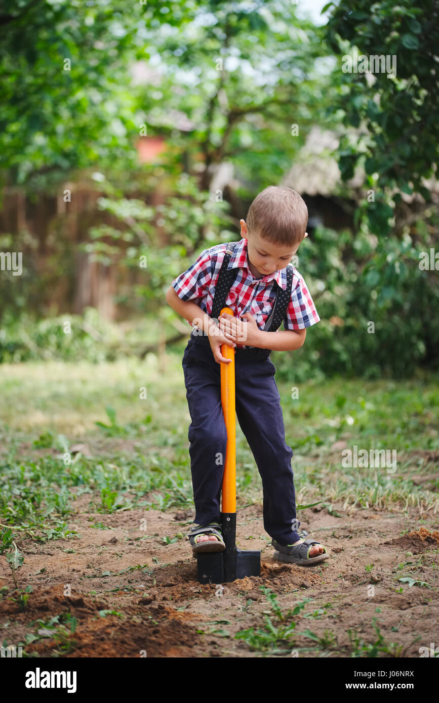 Boy digging in dirt hi-res stock photography and images - Alamy