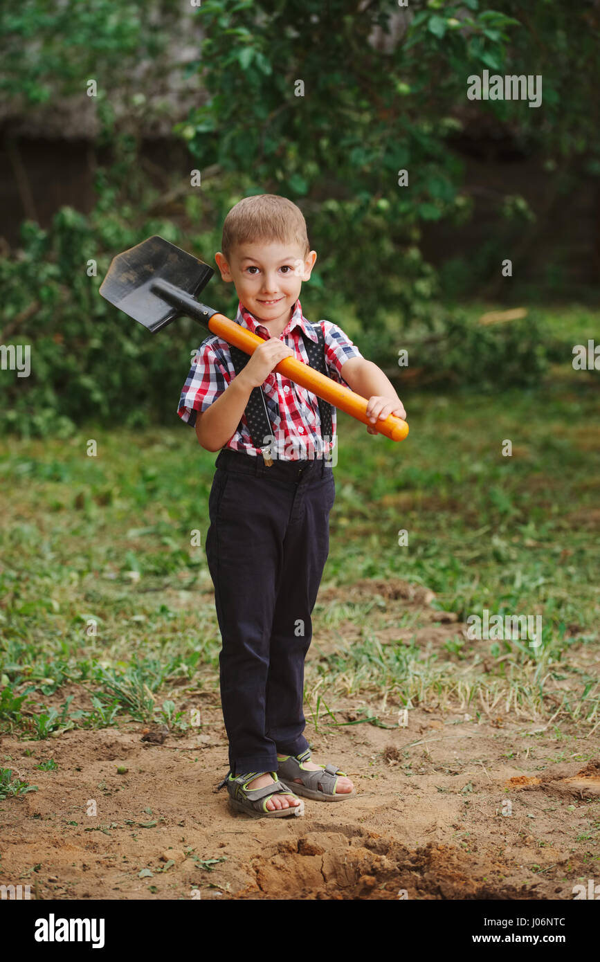 Boy shovel hi-res stock photography and images - Alamy