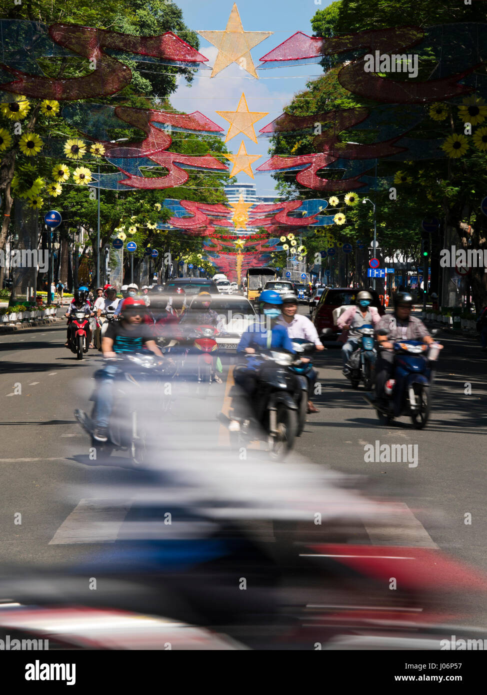 Vertical view of people riding mopeds in Vietnam Stock Photo - Alamy