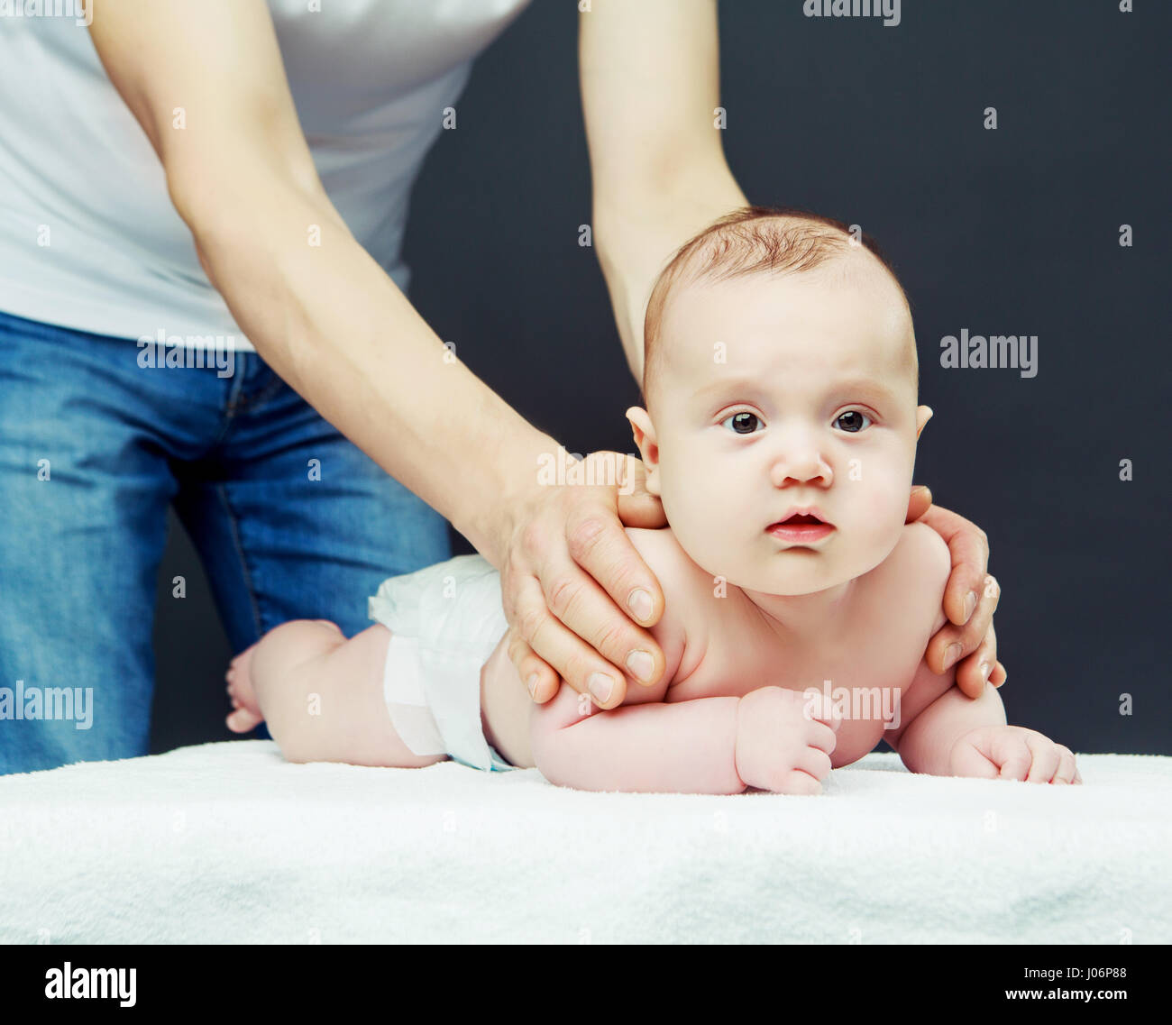 Baby massage hi-res stock photography and images - Alamy