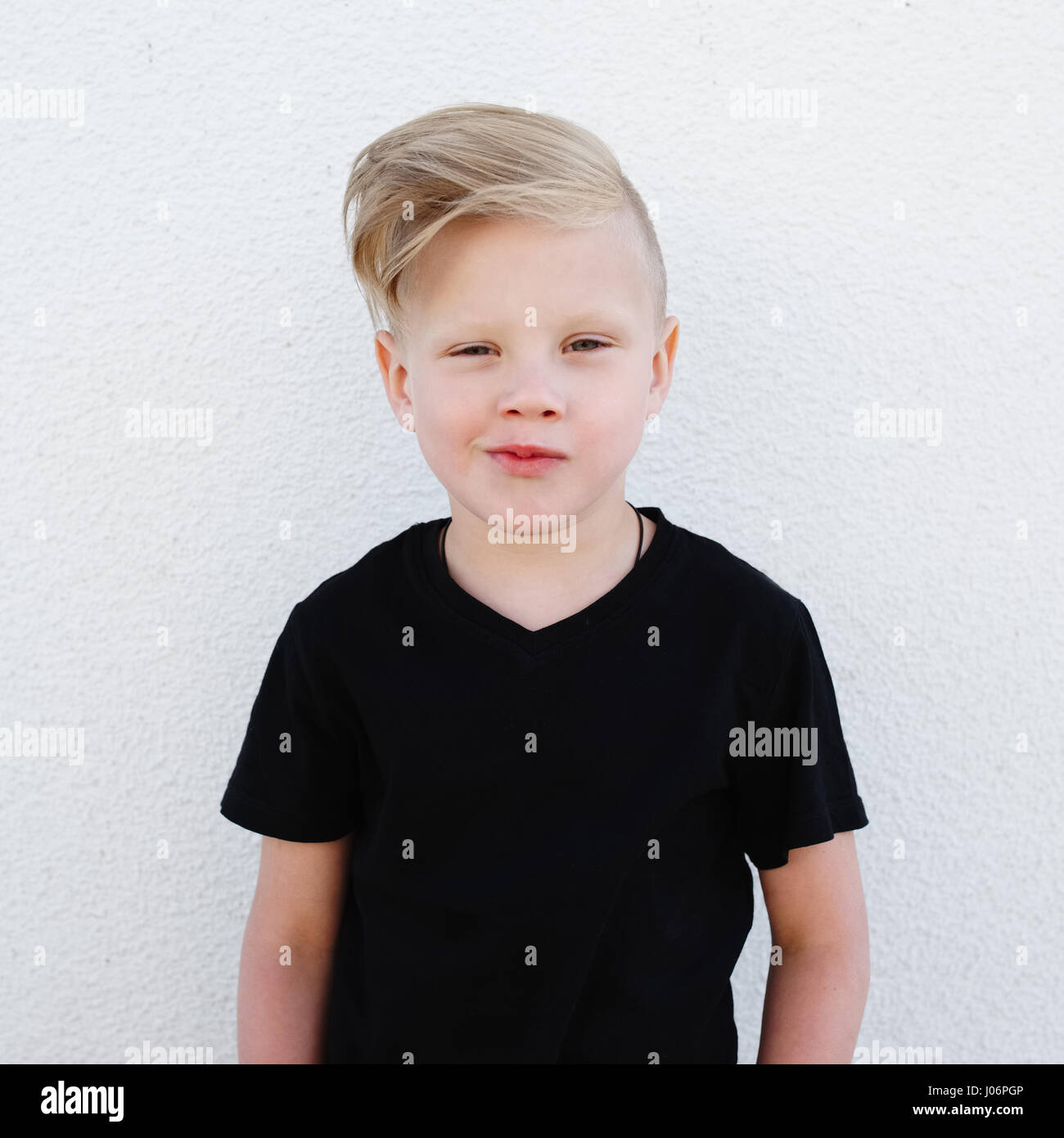 young emotional boy on bright background Stock Photo - Alamy