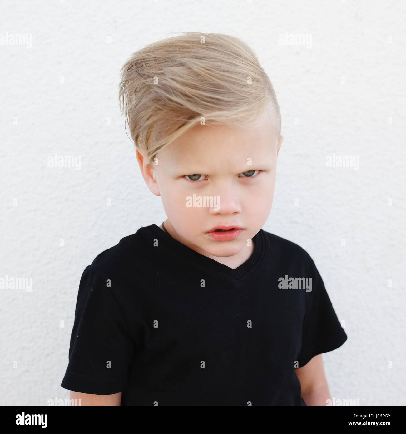 young emotional boy on bright background Stock Photo - Alamy
