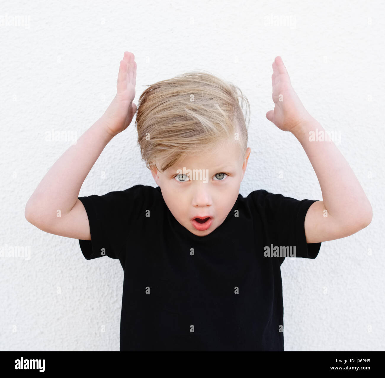 young emotional boy on bright background Stock Photo - Alamy